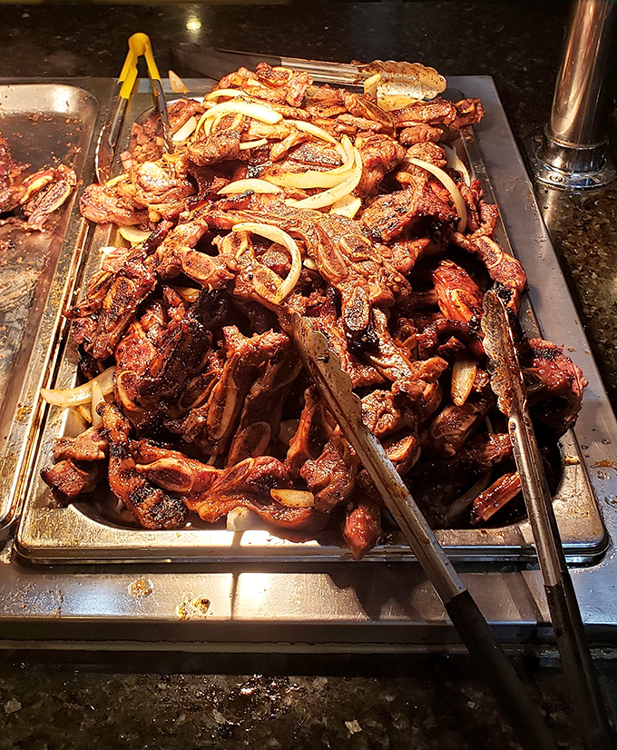 Korean galbi glistens under the heat lamps, a mountain of marinated meat that's worth climbing without supplemental oxygen.