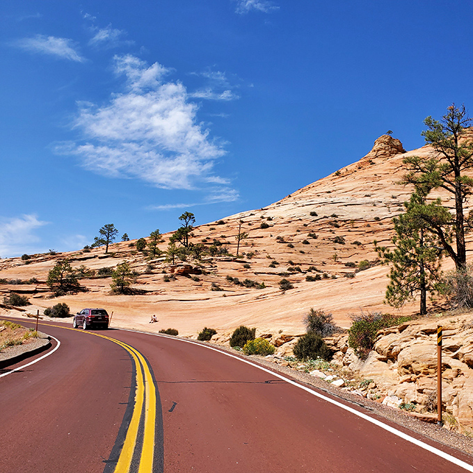 The striated sandstone tells 150 million years of Earth's autobiography. Each layer is a chapter in the planet's most compelling memoir.