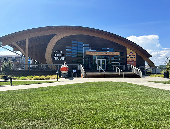 The striking modern entrance to Mystic Seaport Museum belies the centuries of maritime history waiting just beyond those doors.