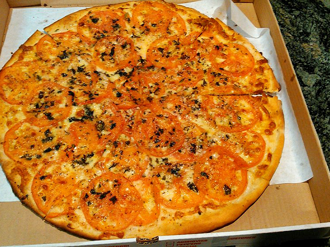 Behold the fresh tomato pie&mdash;sunshine in circular form. Those vibrant slices nestled on that golden crust prove simplicity is the ultimate sophistication.