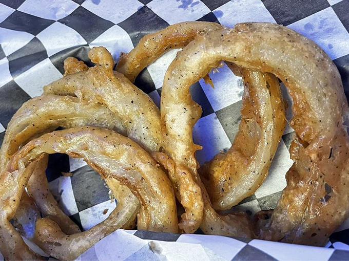 Onion rings so perfectly golden they deserve their own Olympic medal. Crispy on the outside, tender within—the textbook definition of fried perfection.