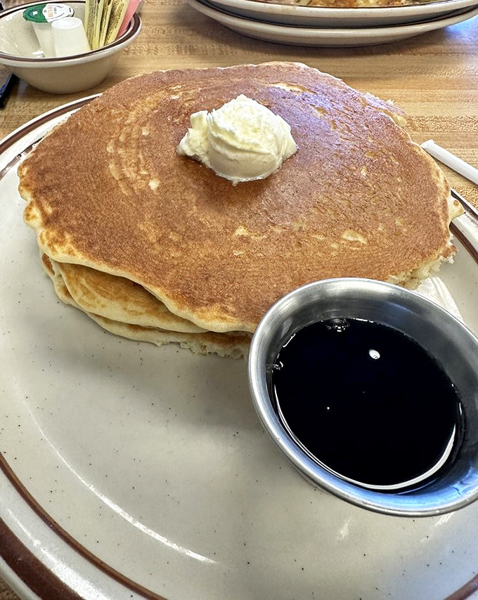 Pancakes the size of hubcaps with a dollop of butter slowly melting into breakfast perfection. Syrup application is a personal journey.