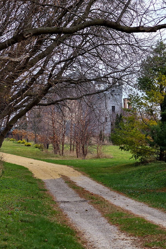 Winding paths through the grounds invite exploration, promising discoveries around every turn and tree.