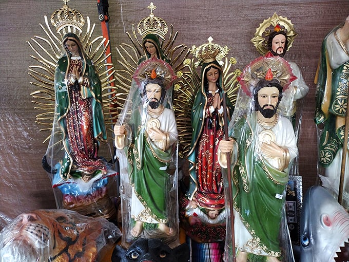 Holy bargains, Batman! Religious statues stand in silent formation, ready to bless homes across Michigan at a fraction of retail prices.