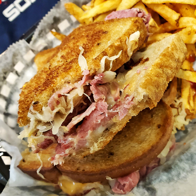 The Reuben reveals its secrets: perfectly grilled bread, melty cheese, and that harmonious marriage of corned beef and sauerkraut. A sandwich worth crossing county lines for.