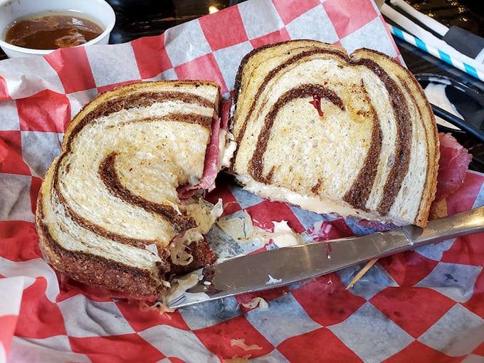 A proper Reuben should require strategic planning to eat. This marble rye masterpiece demands both hands and zero distractions.