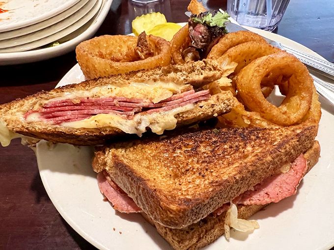 The Reuben sandwich here doesn't just come with onion rings&mdash;it arrives with golden halos of crispy perfection that would make angels jealous.
