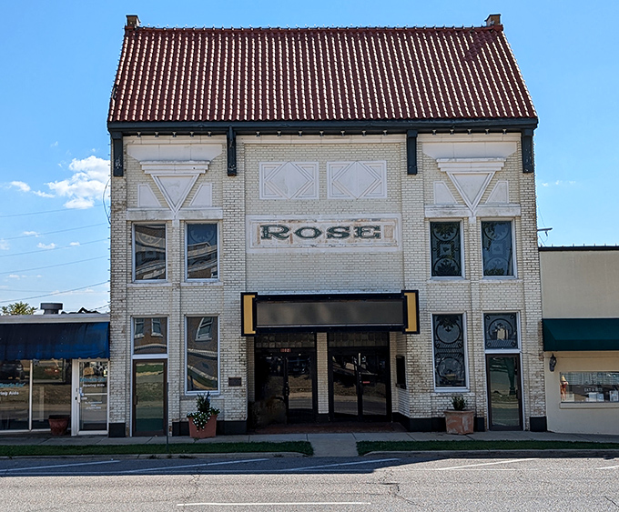 The historic Rose Theatre stands as Bastrop's cultural cornerstone, its distinctive white facade and ornate details hinting at performances that have delighted generations.