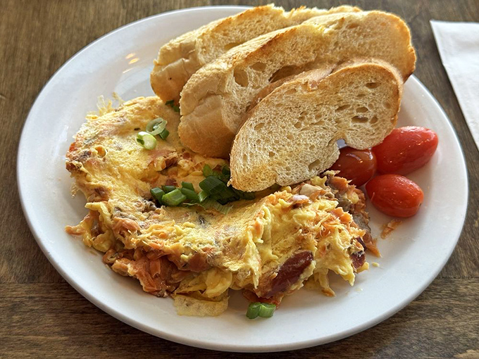 This isn't just breakfast&mdash;it's an omelet masterpiece with perfectly toasted sourdough standing at attention, ready for its supporting role.
