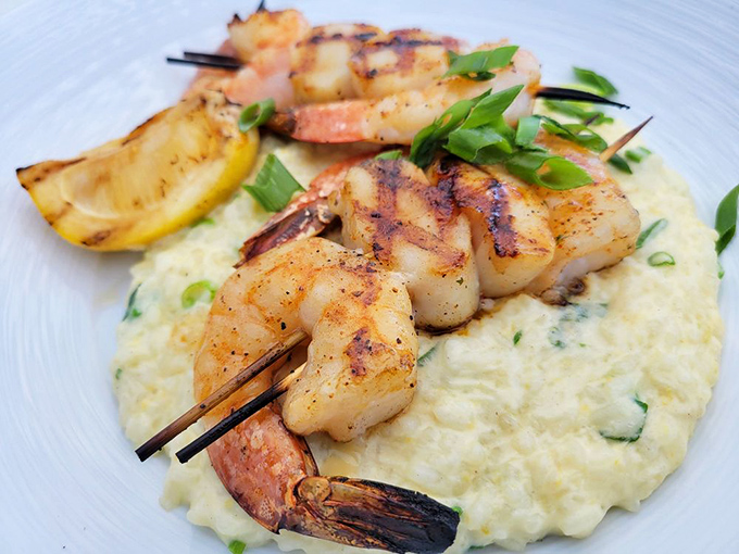 Grilled shrimp nestled on creamy risotto like they were born to be there. The kind of dish that makes you forget you're 700 miles from the nearest ocean.