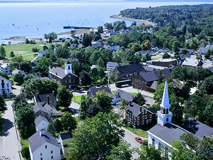From above, Searsport reveals its perfect balance &ndash; part working harbor, part postcard-perfect New England town, all authentic Maine.