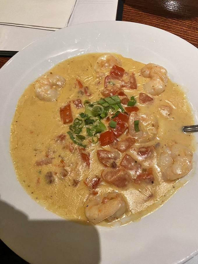 Shrimp and grits: the dish that proves Southern comfort food is actually sophisticated cuisine in disguise. Those green onions aren't garnish&mdash;they're confetti celebrating flavor.