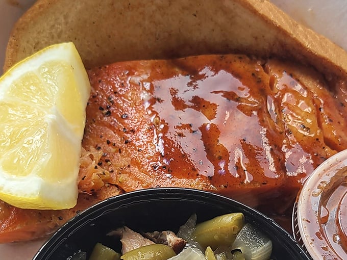 Salmon that's been kissed by smoke and dressed with sauce, proving Elmer's isn't just about traditional barbecue proteins. That lemon wedge isn't just garnish&mdash;it's essential.