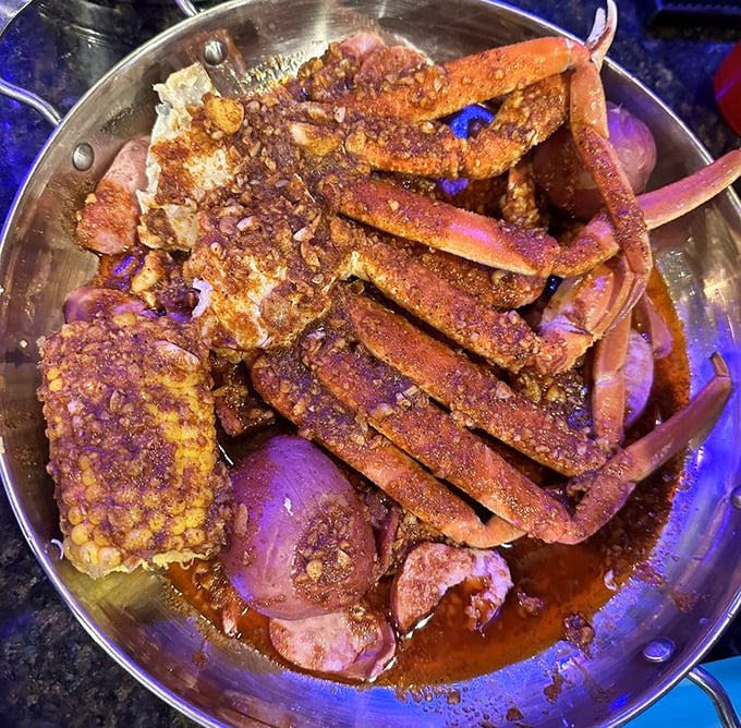 This isn't just dinner; it's a glorious mess of snow crab legs, corn, and potatoes swimming in spiced butter. Bibs aren't optional&mdash;they're essential.