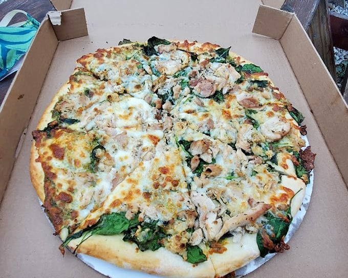 When your pizza toppings look like a garden party crashed by some chicken, you know you're in for a flavor festival.