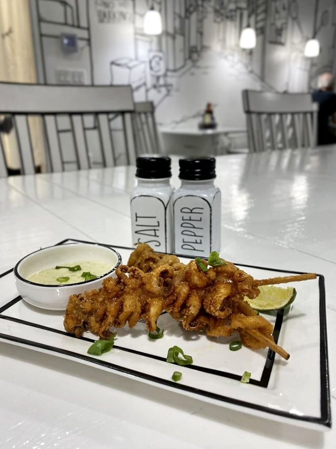 Crispy squid on a stick proves that even seafood looks more dramatic against a comic book backdrop. The dipping sauce adds a colorful plot twist.