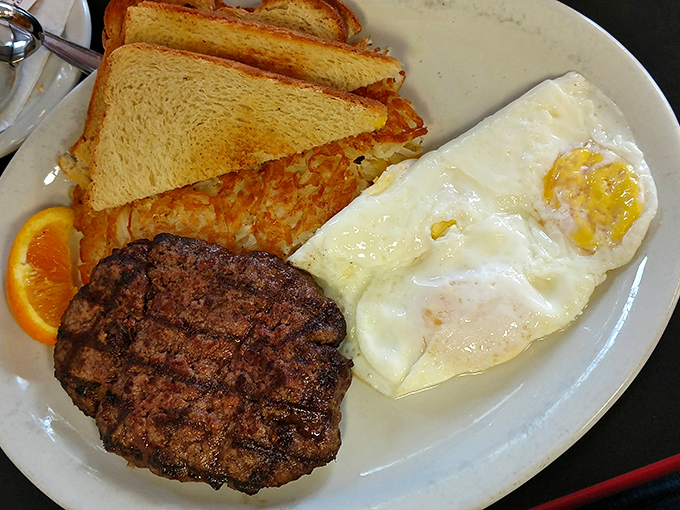 When a burger patty joins eggs for breakfast, magic happens. This plate says "fuel up" in the universal language of hearty meals.