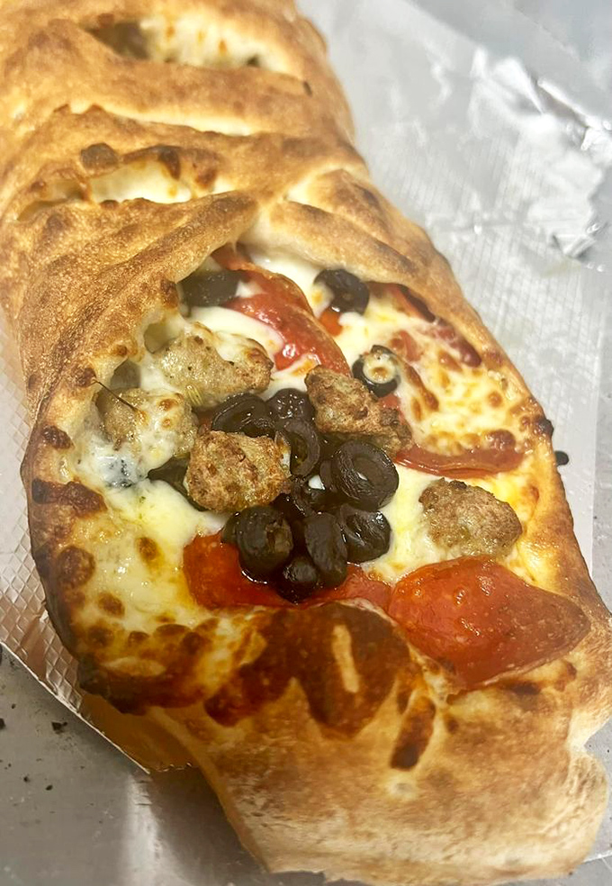 The stromboli: Italy's answer to the burrito, if burritos went to finishing school and came back with a degree in deliciousness.