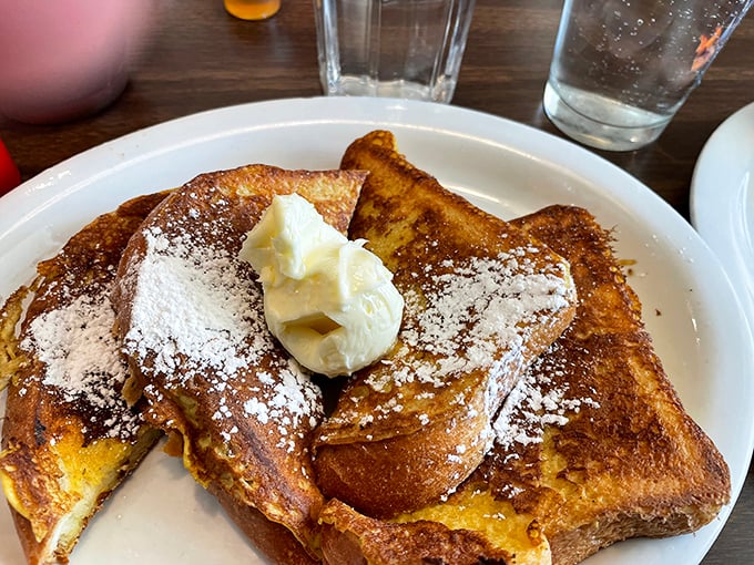 French toast dusted with powdered sugar and crowned with butter. The kind of breakfast that makes you forgive winter for sticking around so long.