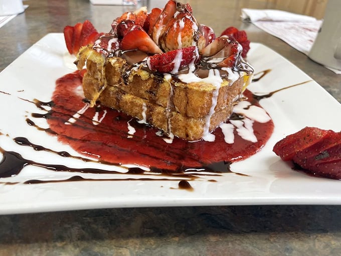 French toast that could make a Parisian jealous, topped with strawberries and cream – breakfast or dessert? The line deliciously blurs.