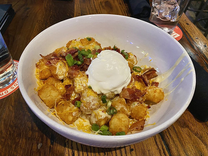 Totchos: where tater tots meet nacho toppings in a beautiful relationship that makes you wonder why they weren't always together.