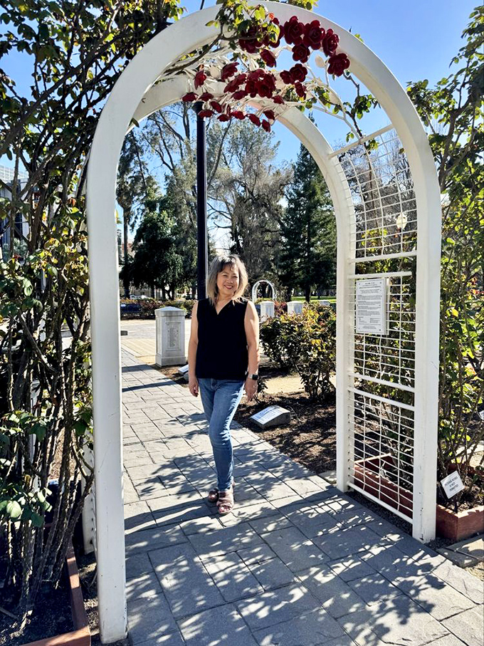 The garden's charming archways invite visitors to literally step into a world where everyday worries seem to dissolve among the petals.