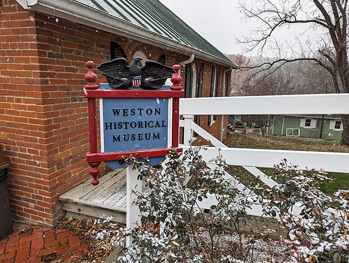 The Weston Historical Museum's eagle-topped sign promises stories more fascinating than fiction – a time capsule of riverboat days when this tiny town outshined Kansas City.