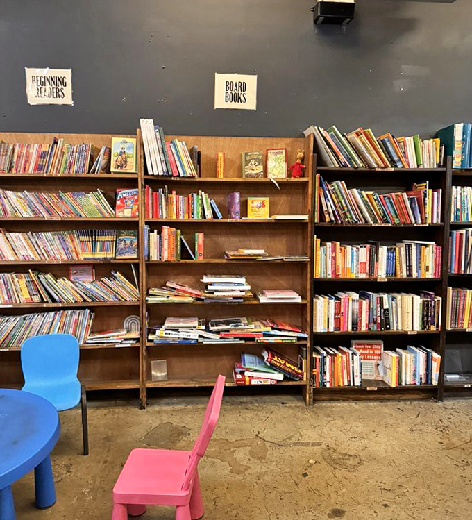 The children's section, where tiny chairs welcome tiny readers. Tomorrow's bookworms are born in corners just like this one.