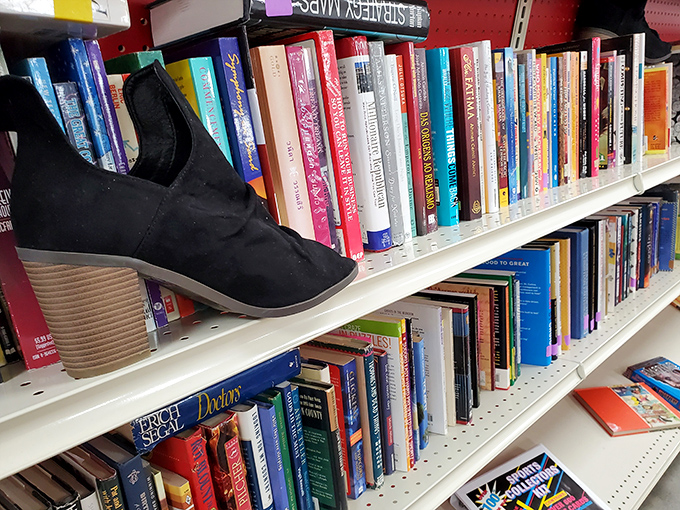 A bibliophile's dream with a shoe photobombing the scene. Books and unexpected treasures coexist in this literary corner of bargain paradise.