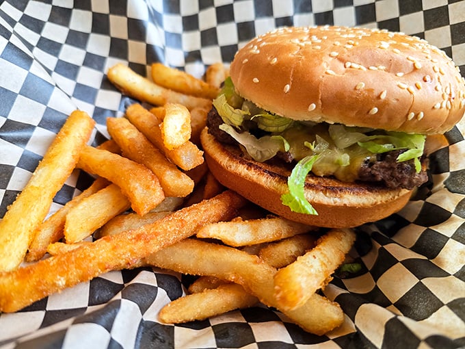 The classic burger and fries combo served on checkered paper&mdash;proof that simplicity, when done right, needs no introduction or apology.