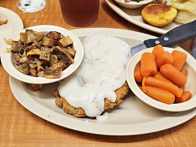 Country fried steak swimming in peppery gravy&mdash;the kind of dish that makes you want to hug the cook.