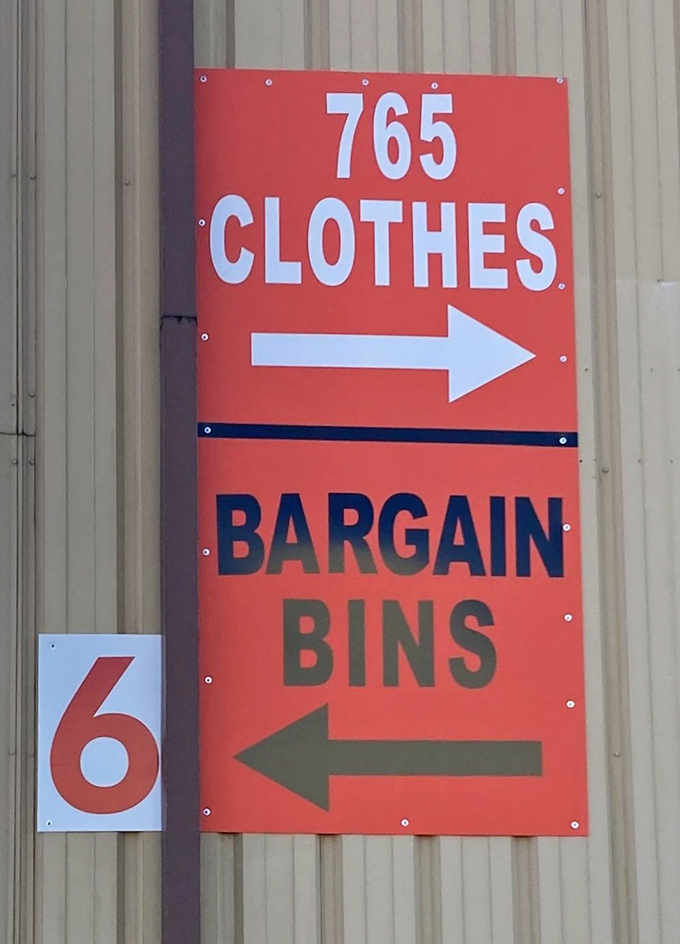 Follow the bright orange signs to bargain bliss. Like breadcrumbs in a retail forest, these markers lead straight to shopping salvation.