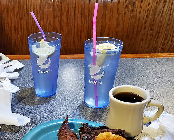 Cold drinks and hot coffee—the perfect companions for a buffet marathon. Those blue Pepsi glasses have witnessed countless "just one more plate" promises.