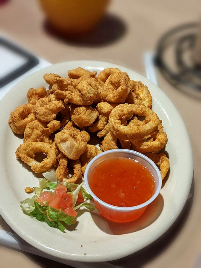 These golden-fried calamari rings aren't just appetizers &ndash; they're crispy hoops of joy that disappear faster than Nebraska football tickets.