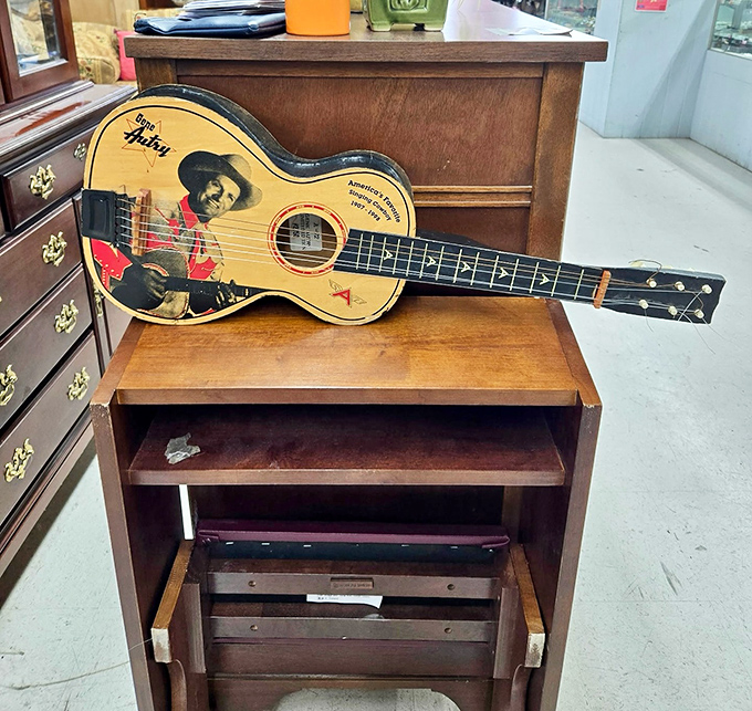 Not just any guitar—a piece of Nashville soul waiting for its next songwriter. The worn fretboard speaks of countless melodies already discovered.