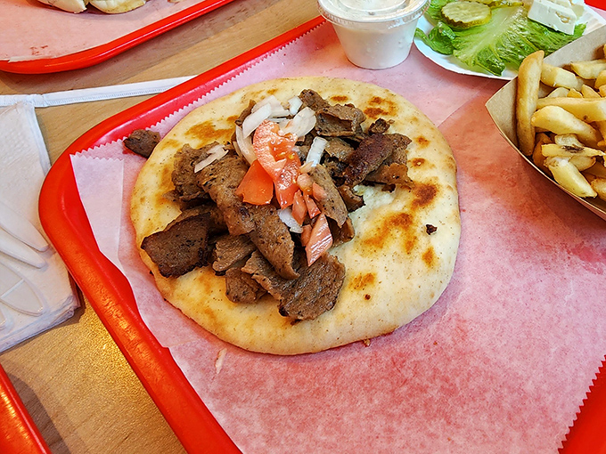 This gyro isn't just a sandwich; it's a Mediterranean vacation on flatbread. The meat-to-veggie ratio achieves perfect diplomatic relations.