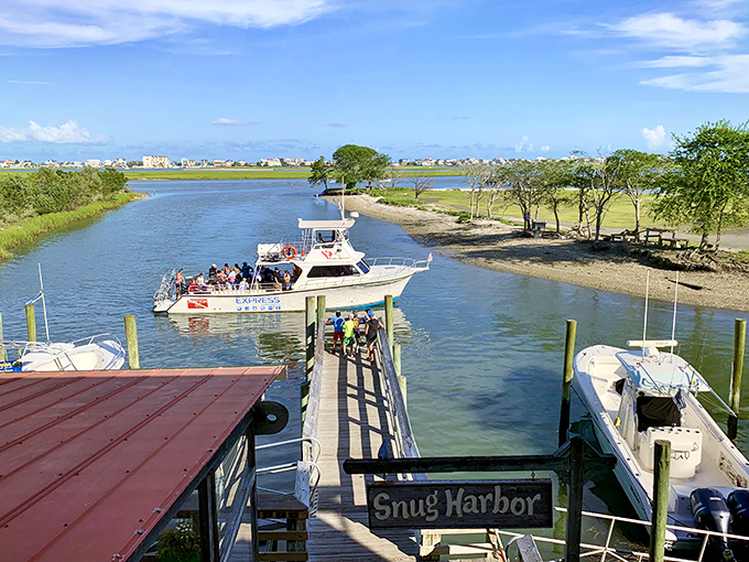 Snug Harbor's dock welcomes charter boats and fishing enthusiasts ready to chase their next big catch.