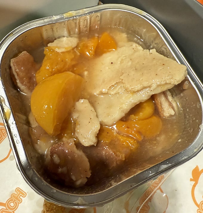 Not just peach cobbler &ndash; a warm hug in dessert form. Tender fruit swimming beneath a buttery crust that somehow manages to stay crisp despite the juicy filling.