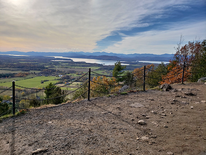 The payoff view that makes every uphill step worthwhile. Lake Champlain stretches toward the Adirondacks like a blue highway.