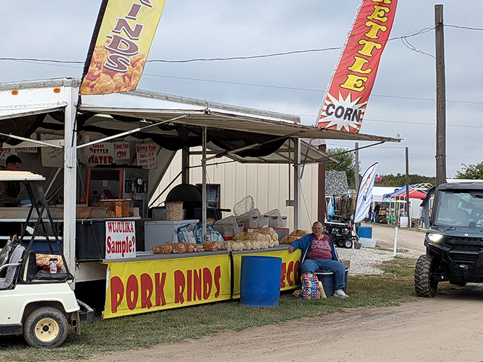The siren call of "Pork Rinds" and kettle corn banners&mdash;where diet plans go to die and weekend indulgences are born.