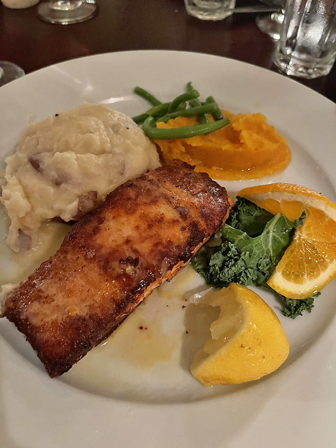Perfectly seared salmon with a golden crust resting alongside fluffy mashed potatoes and vibrant vegetables&mdash;a plate that would make Neptune himself nod in approval.