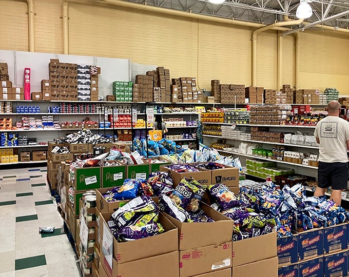 Snack paradise! Boxes stacked to the ceiling like a carb-lover's dream, where buying in bulk actually makes sense for once.