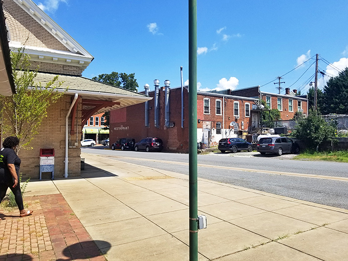 A quiet moment on a brick sidewalk where time slows down and nobody's checking their phone. Remember those days?