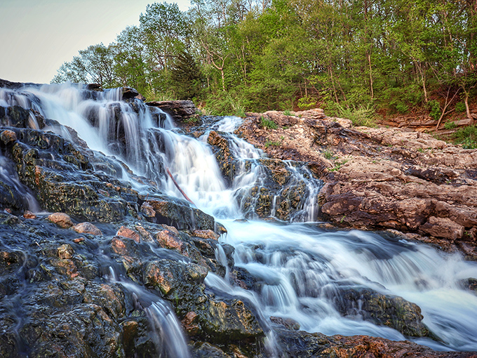 Water doesn't fall, it dances here—a geological performance that's been running longer than Broadway's longest show.