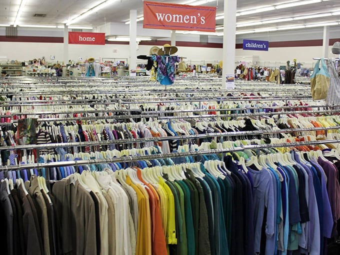 The women's section stretches toward the horizon like a textile sea, organized by color rather than designer&mdash;fashion democracy at its finest.