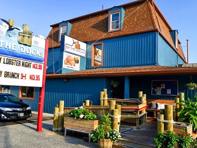 That blue building by the water looks like it grew up from the dock itself.