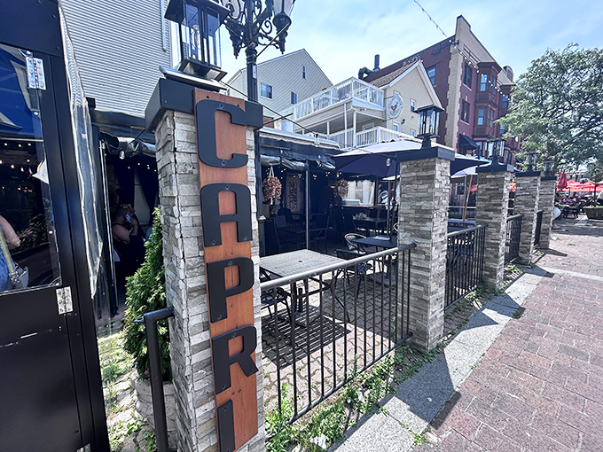 Capri's outdoor dining space invites you to savor Federal Hill's Italian-influenced seafood treasures under twinkling Providence skies.