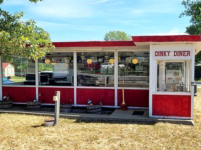The Dinky Diner's cheerful red and white exterior stands ready to serve up breakfast magic that's anything but small.