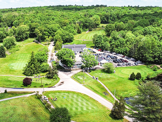 Foster Country Club's lush green fairways stretch through beautiful forests, offering peaceful golf surrounded by Rhode Island's natural beauty.