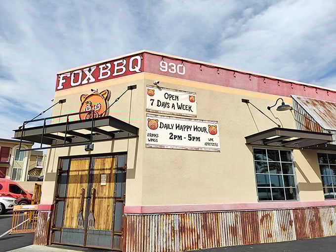 Fox Smokehouse's rustic exterior with corrugated metal trim screams authentic roadside BBQ. That cartoon fox knows where the good stuff is!